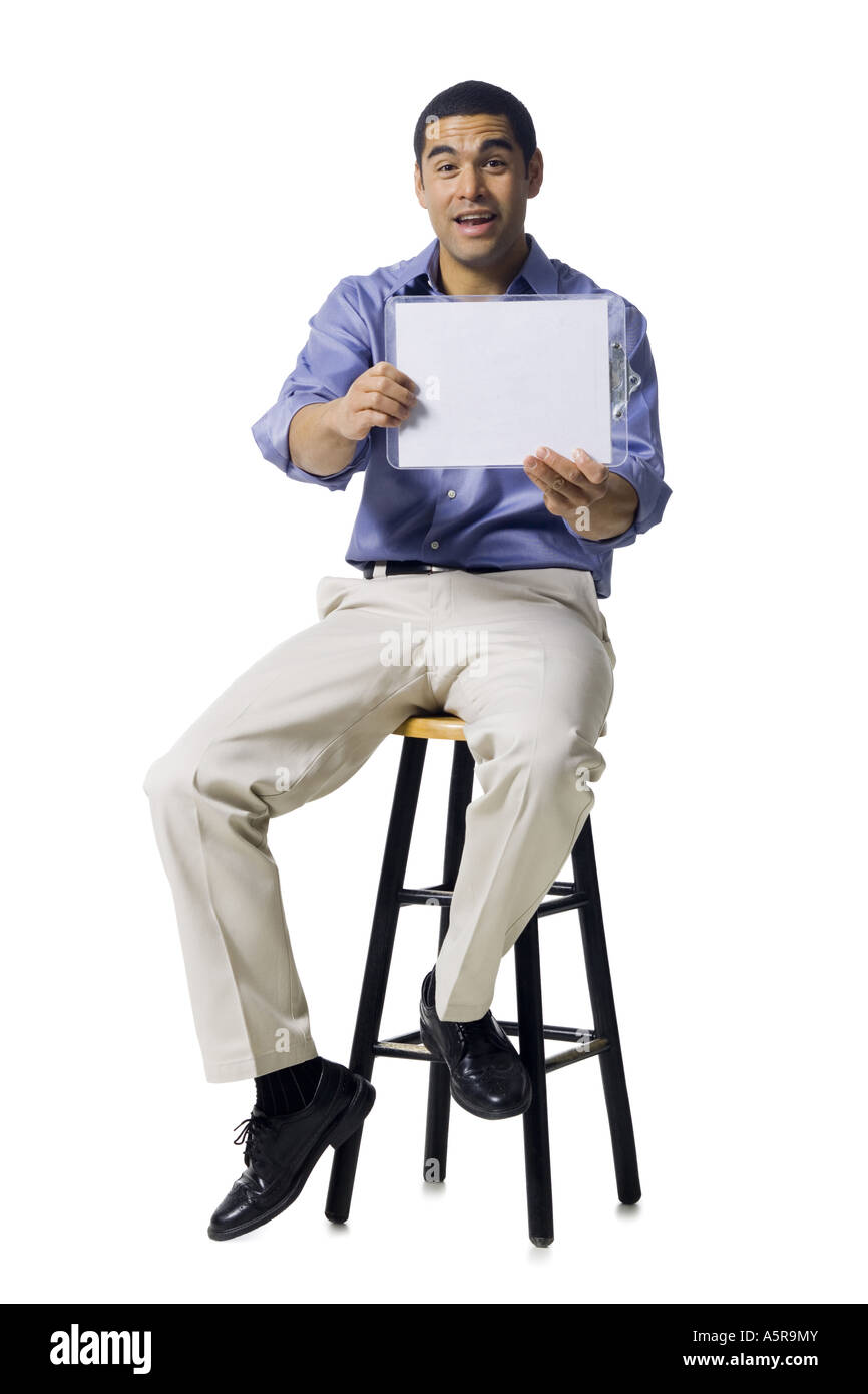 Man standing with blank sign smiling Stock Photo - Alamy