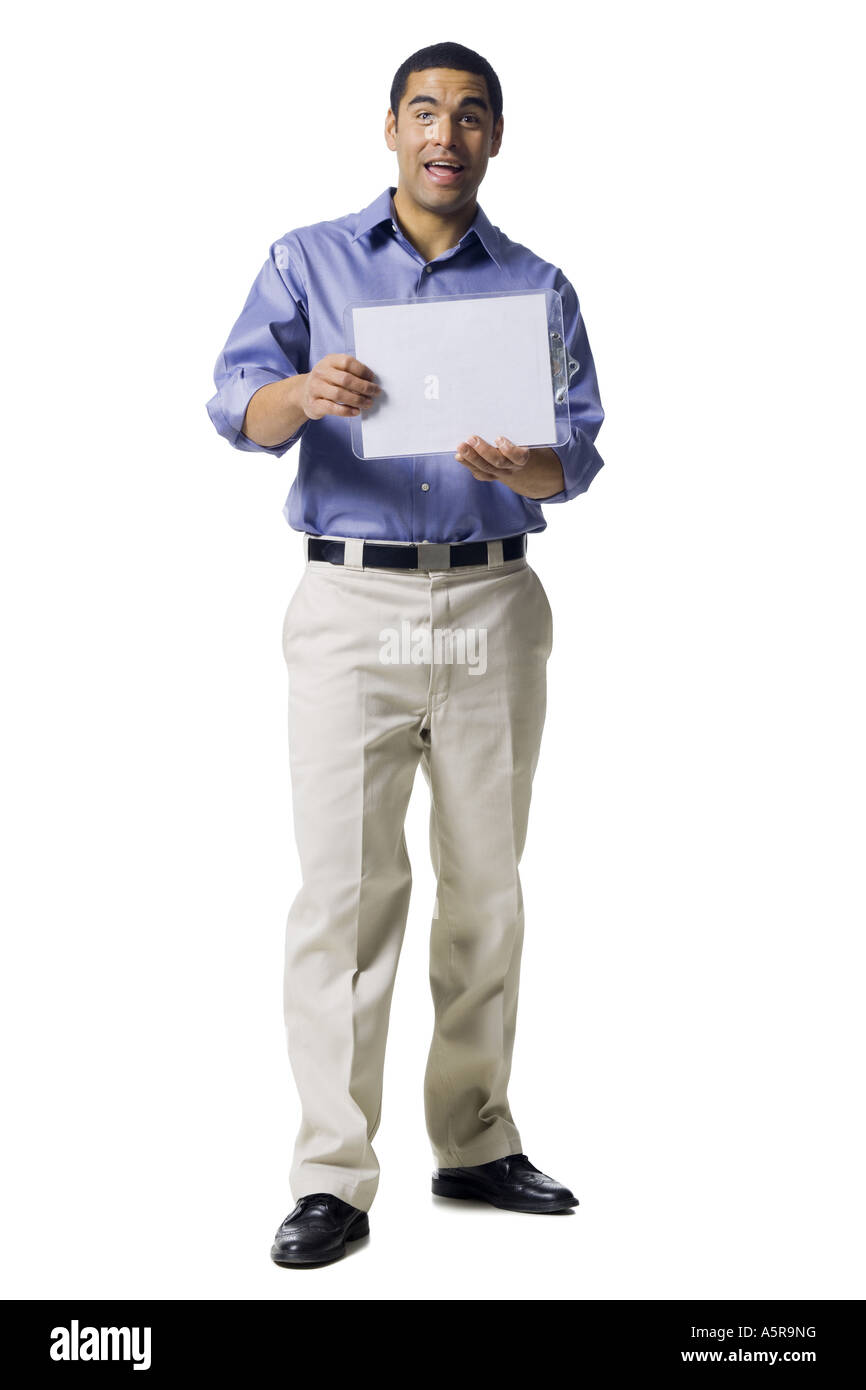 Man standing with blank sign smiling Stock Photo - Alamy