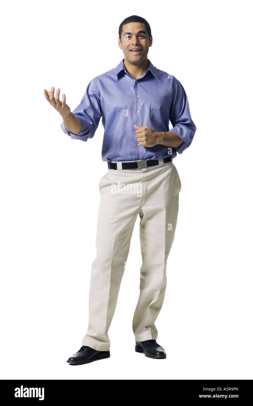 Man standing and gesturing with hands smiling Stock Photo - Alamy