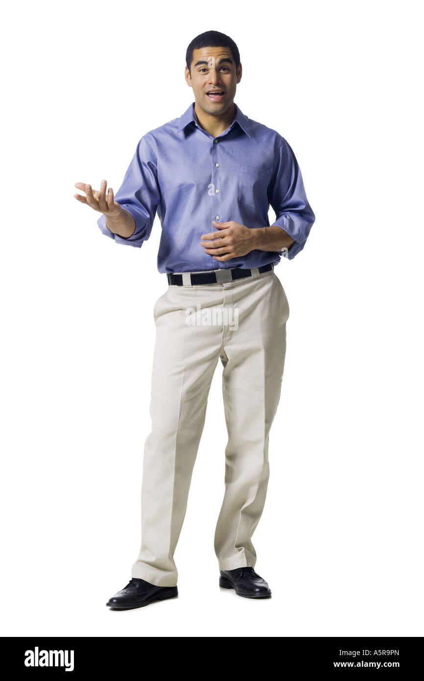 Man standing and gesturing with hands smiling Stock Photo - Alamy