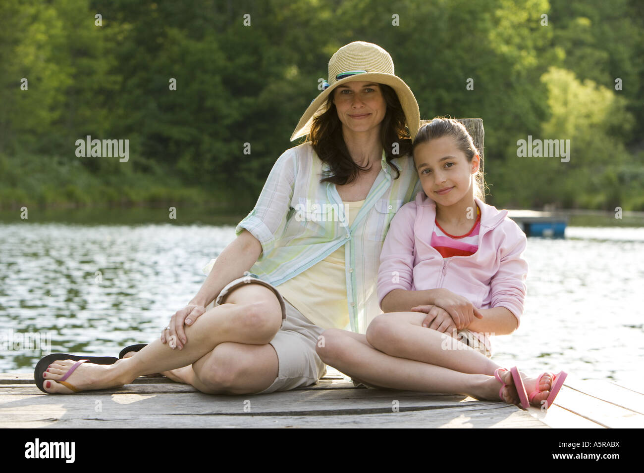 Portrait of a woman and her daughter smiling Stock Photo - Alamy