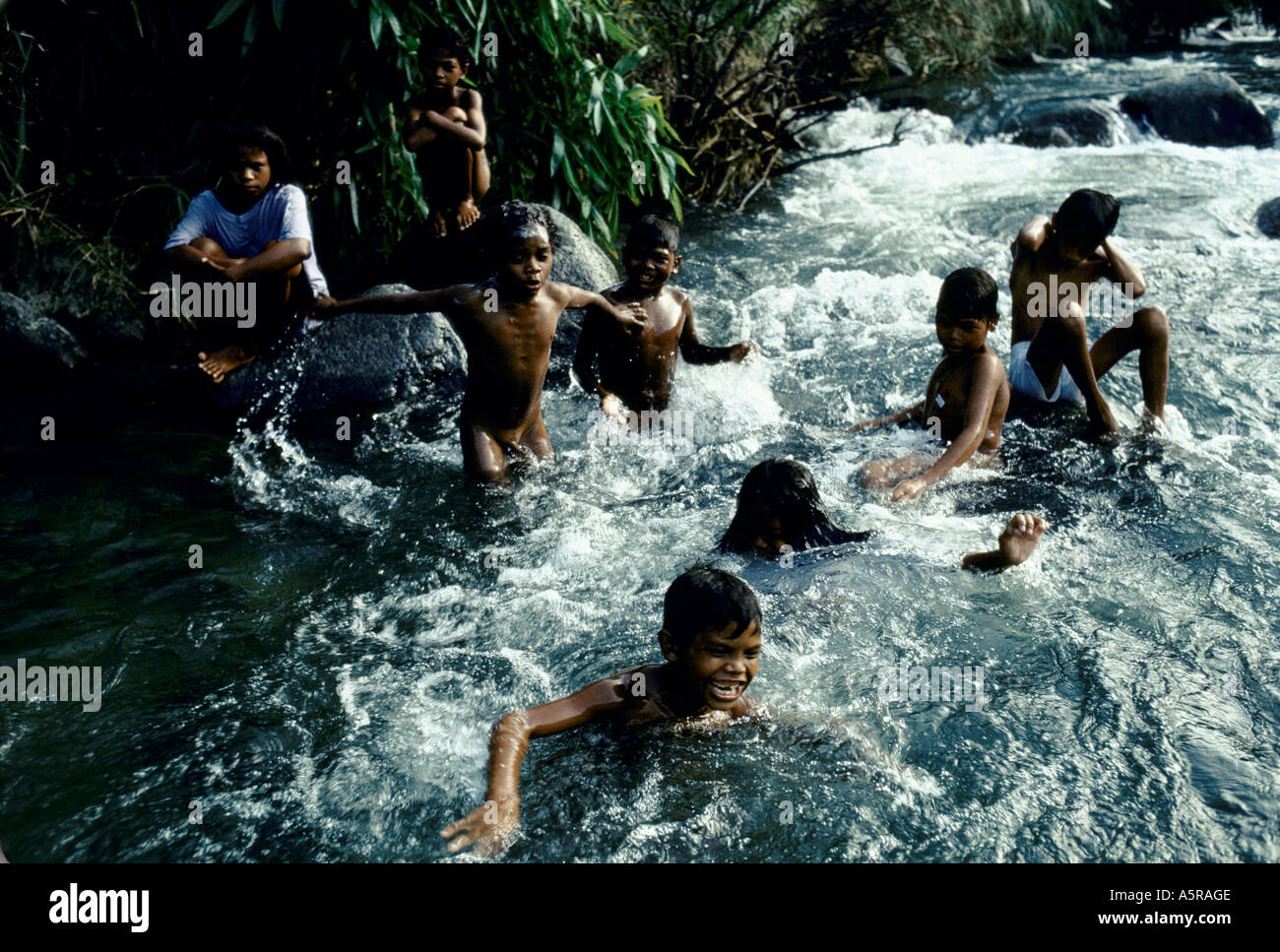 MOUNT PINATUBO DISASTER FEBRUARY 1991 AETA CHILDREN BATHING IN A RIVER ...