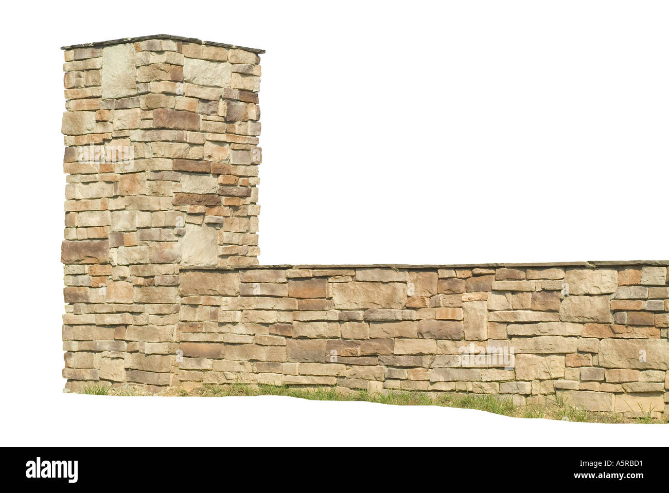 Stone rock wall landscaping fence Stock Photo - Alamy