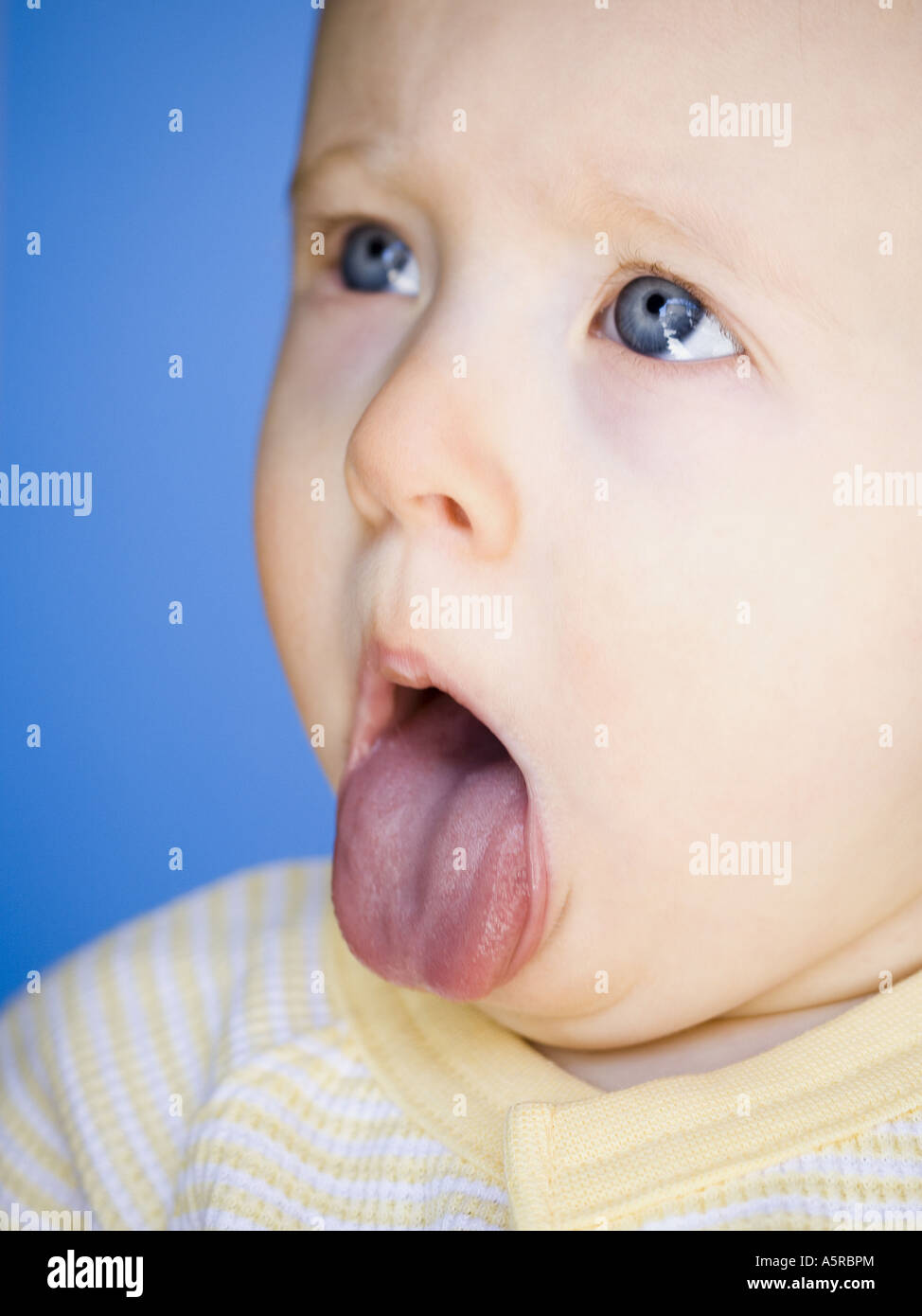 Baby Sticking Tongue Out Stock Photo - Alamy