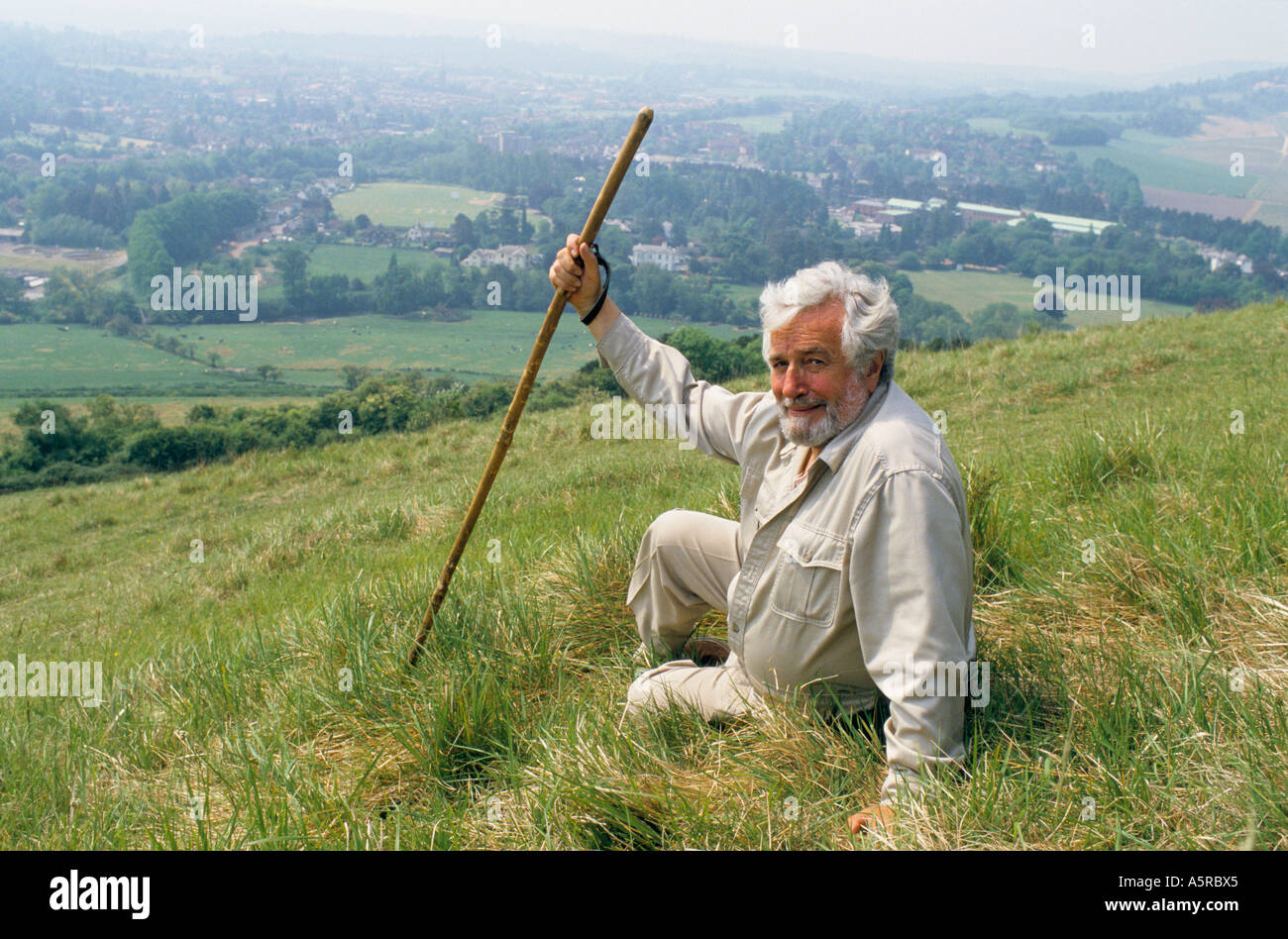 Michael Bentine British comedian comic actor sitting on hill slope ...