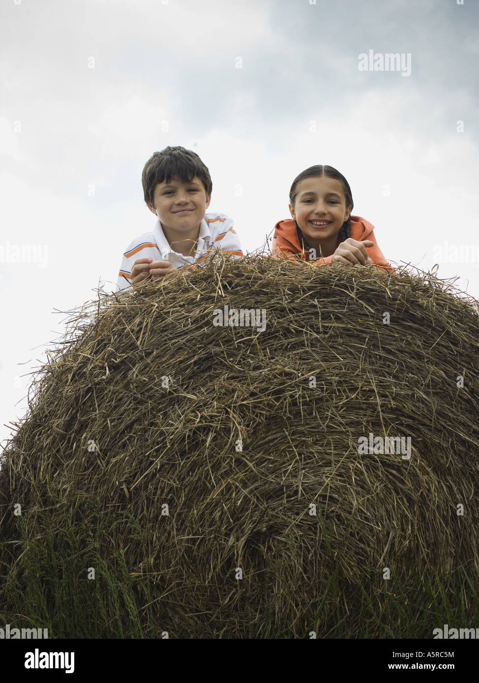 Girl lying on haystack hi-res stock photography and images - Alamy
