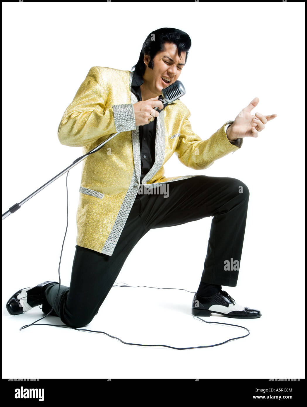 Elvis impersonator singing microphone hi-res stock photography and ...