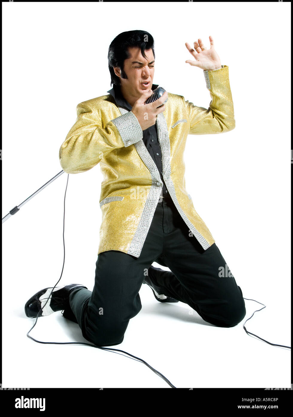 Elvis impersonator singing microphone hi-res stock photography and ...