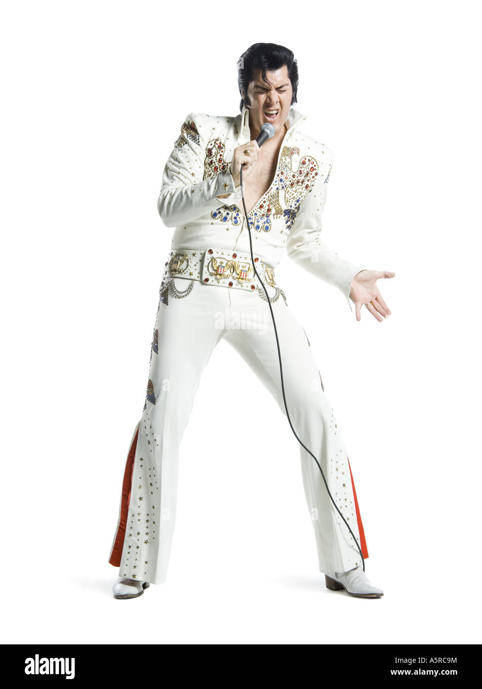 Elvis impersonator singing microphone hi-res stock photography and ...