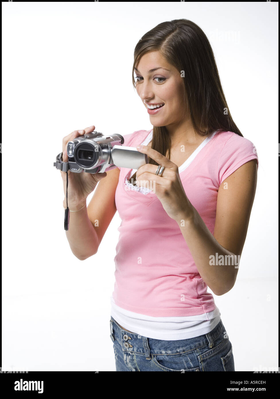 A young woman filming with a home video camera Stock Photo - Alamy