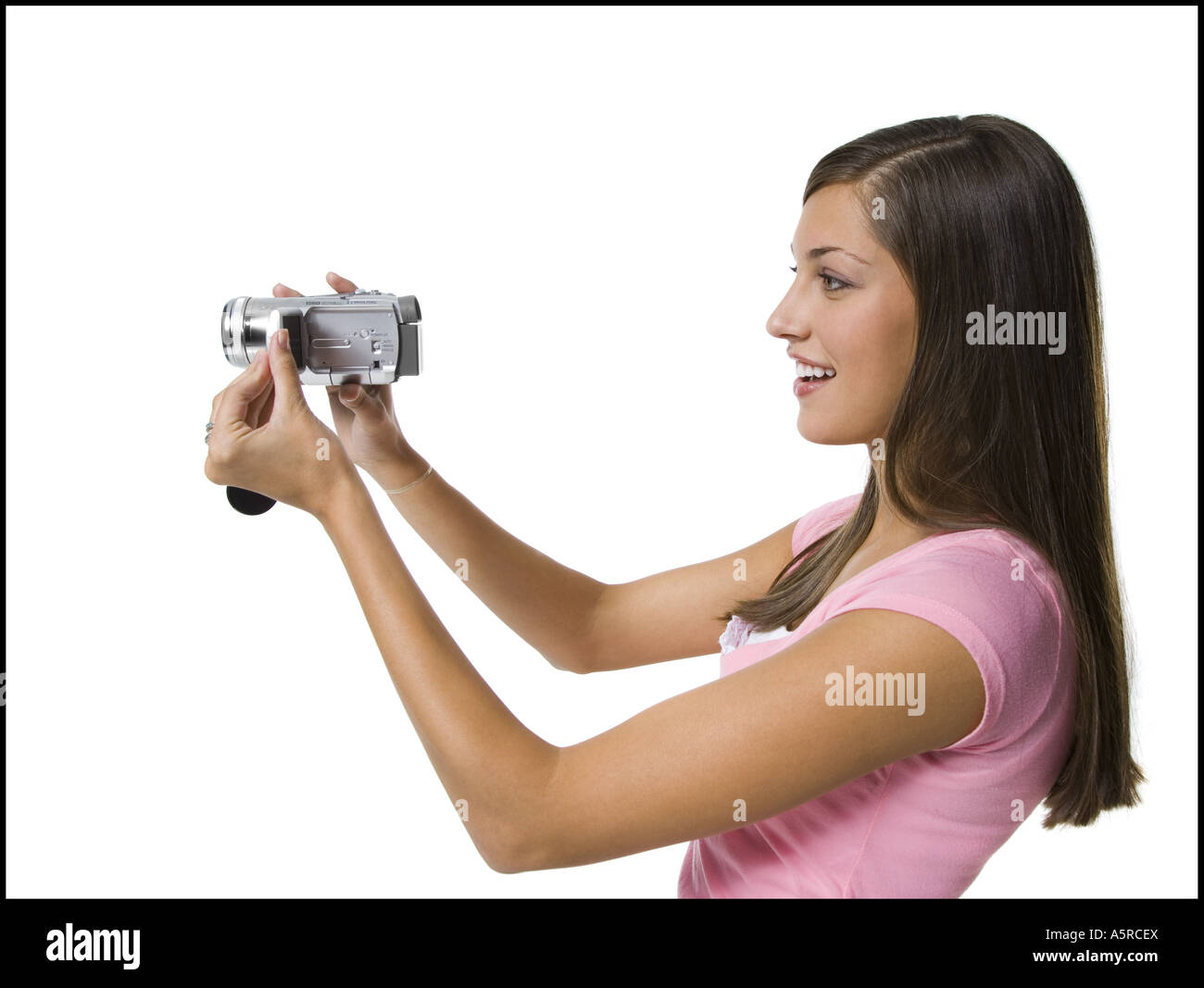 Profile of a young woman holding a video camera Stock Photo - Alamy