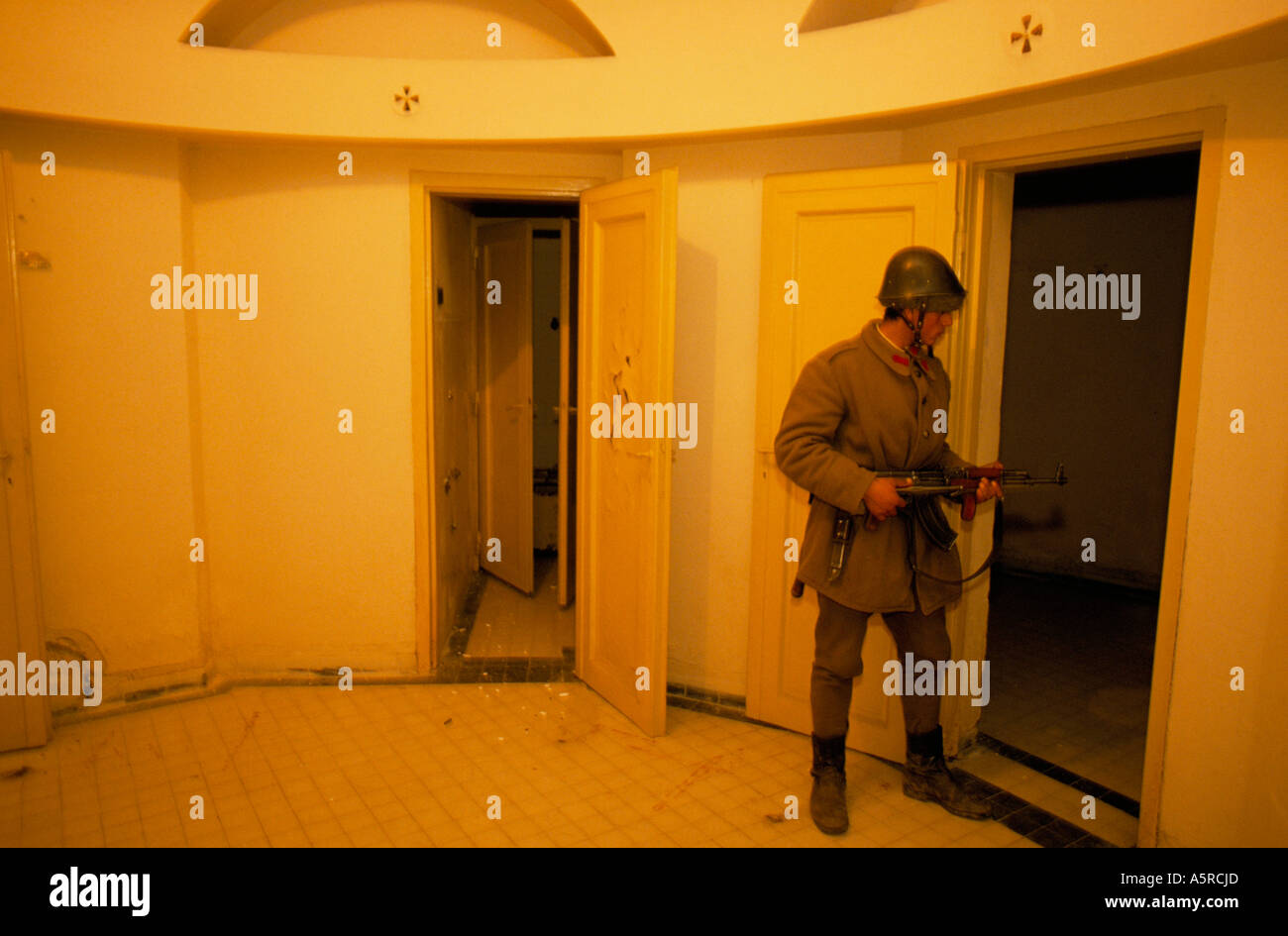 ROMANIAN REVOLUTION 1989 SOLDIER PROCEEDS WITH CAUTION AS HE LOOKS INTO ...
