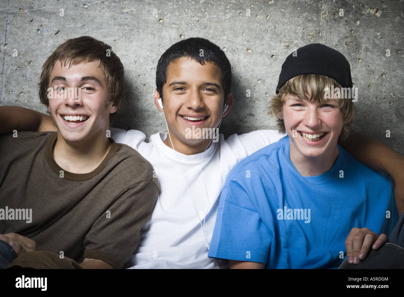Portrait of three teenage boys smiling Stock Photo - Alamy
