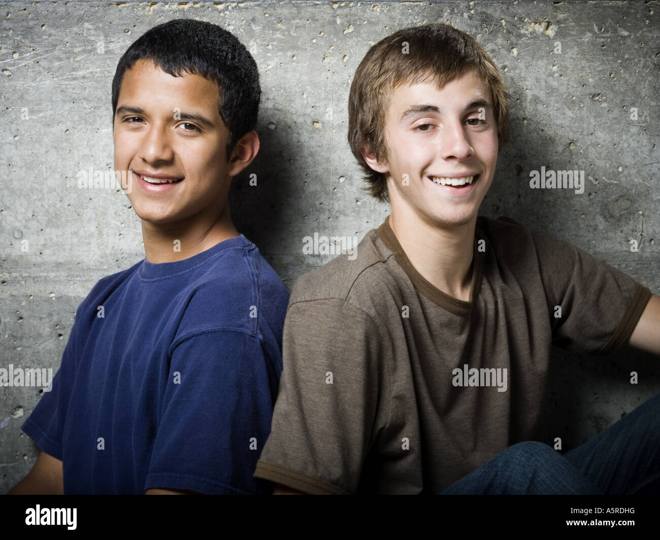 Portrait of two teenage boys smiling Stock Photo - Alamy