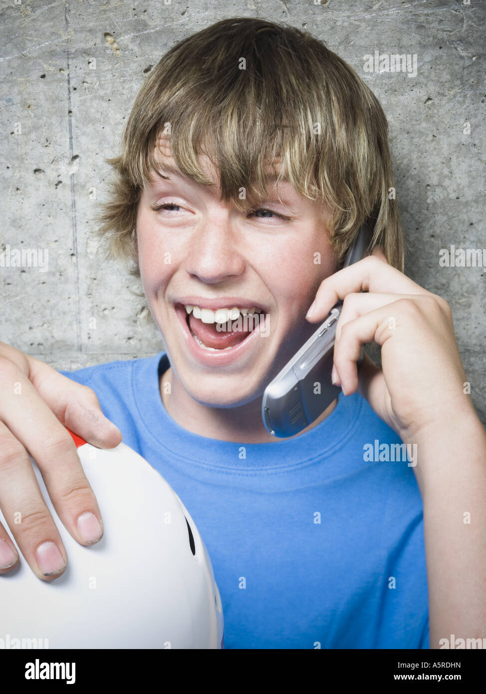 Portrait of a teenage boy using a mobile phone Stock Photo - Alamy