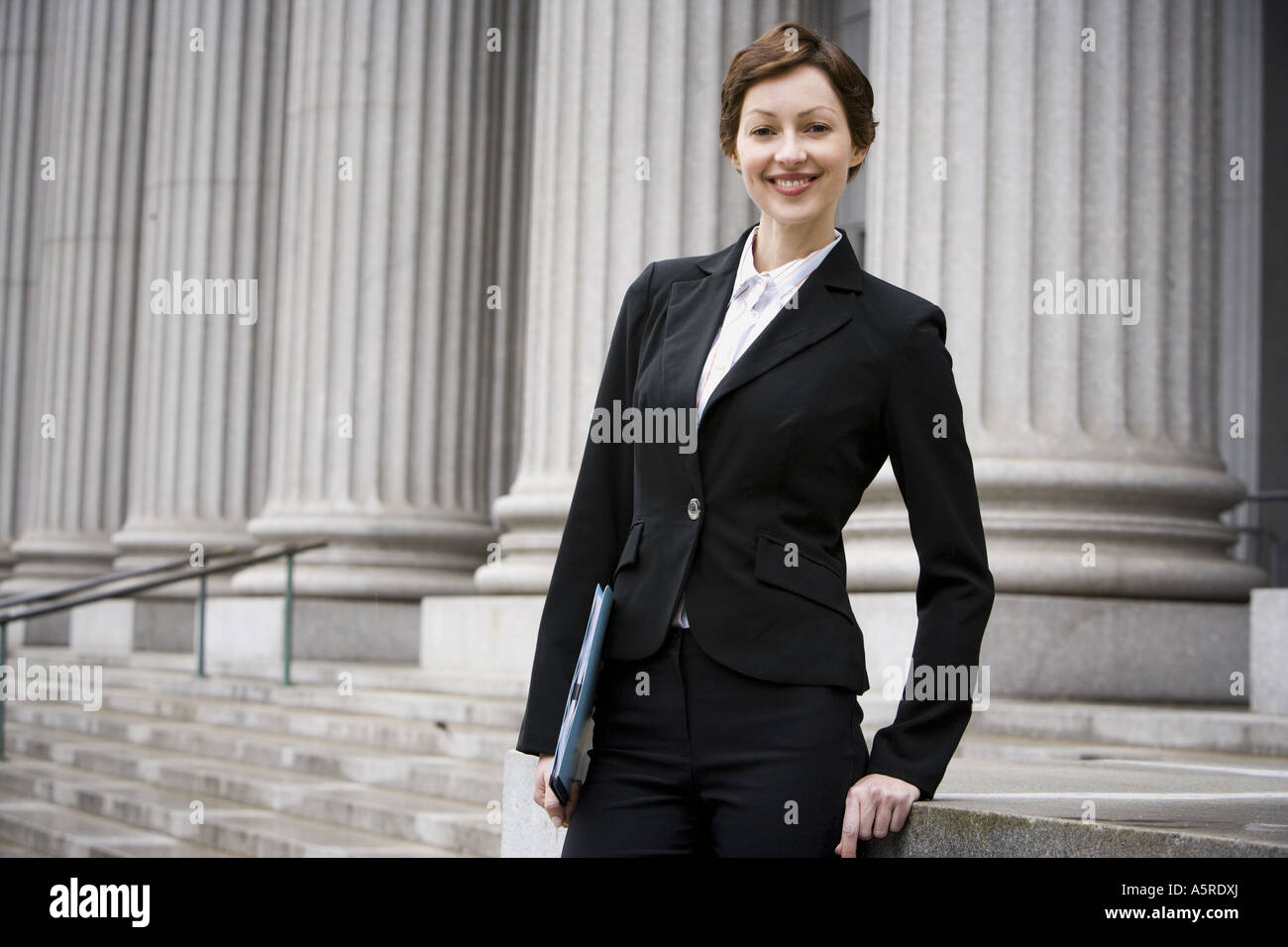 Portrait of a female lawyer smiling Stock Photo - Alamy