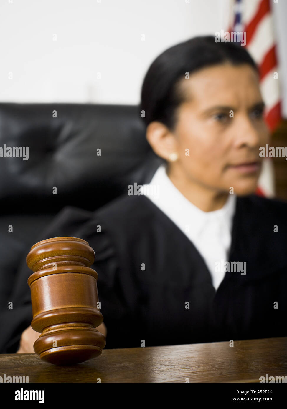 Female judge holding a gavel Stock Photo - Alamy