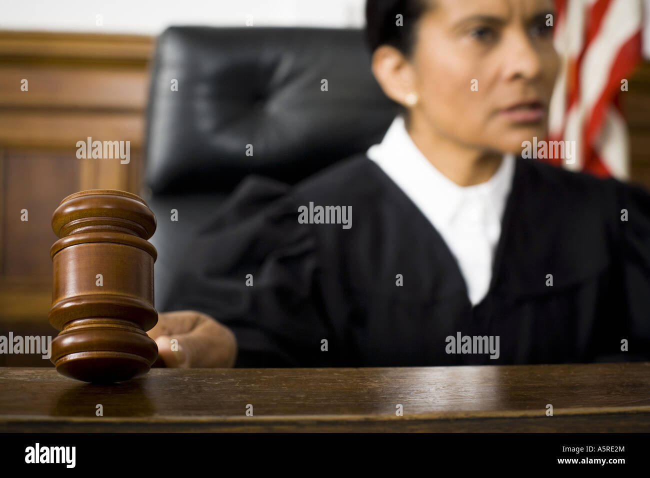 Female judge holding a gavel Stock Photo - Alamy