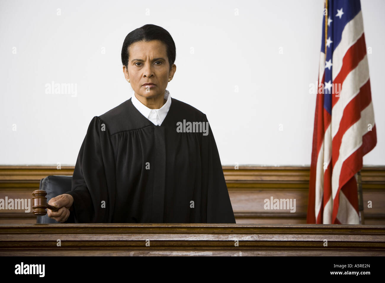 Portrait of a female judge holding a gavel Stock Photo - Alamy