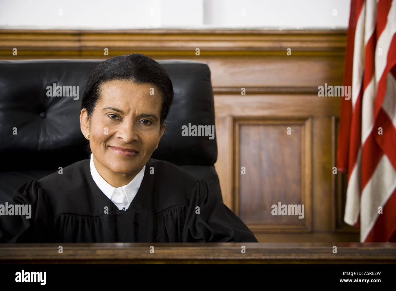 Portrait of a female judge smiling Stock Photo - Alamy