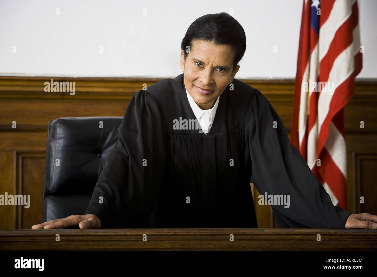 Portrait of a female judge leaning against a bench Stock Photo - Alamy