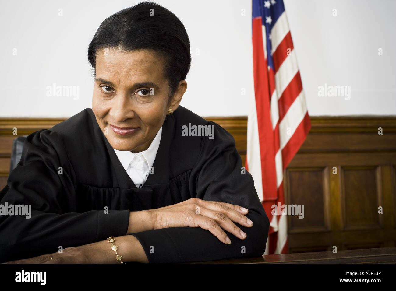 Portrait of a female judge smiling Stock Photo - Alamy