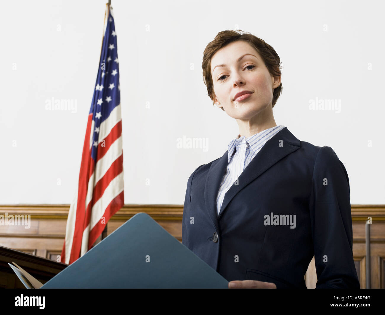 Portrait of a female lawyer standing in a courtroom and smiling Stock ...
