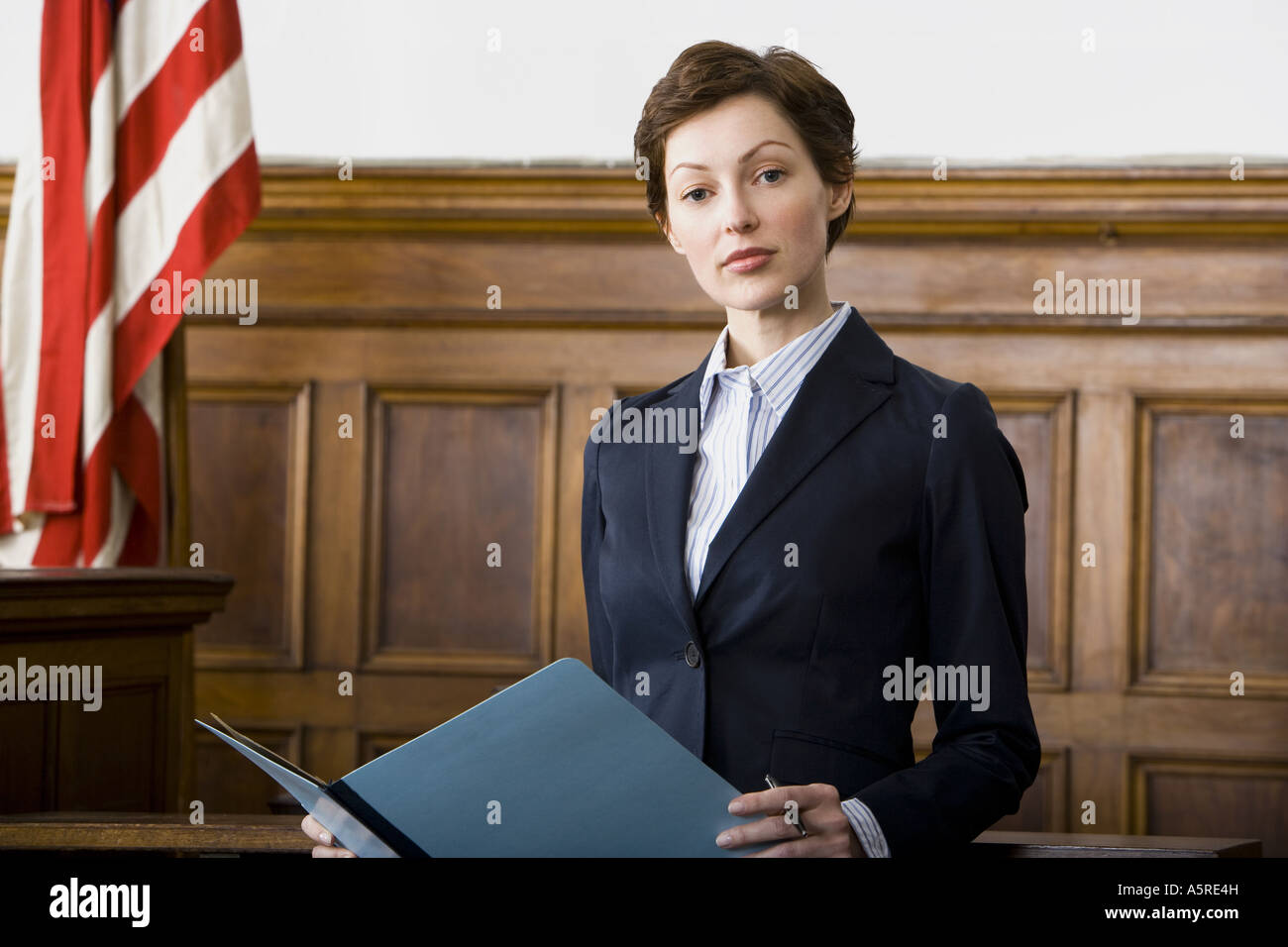 Portrait of a female lawyer standing in a courtroom and smiling Stock ...