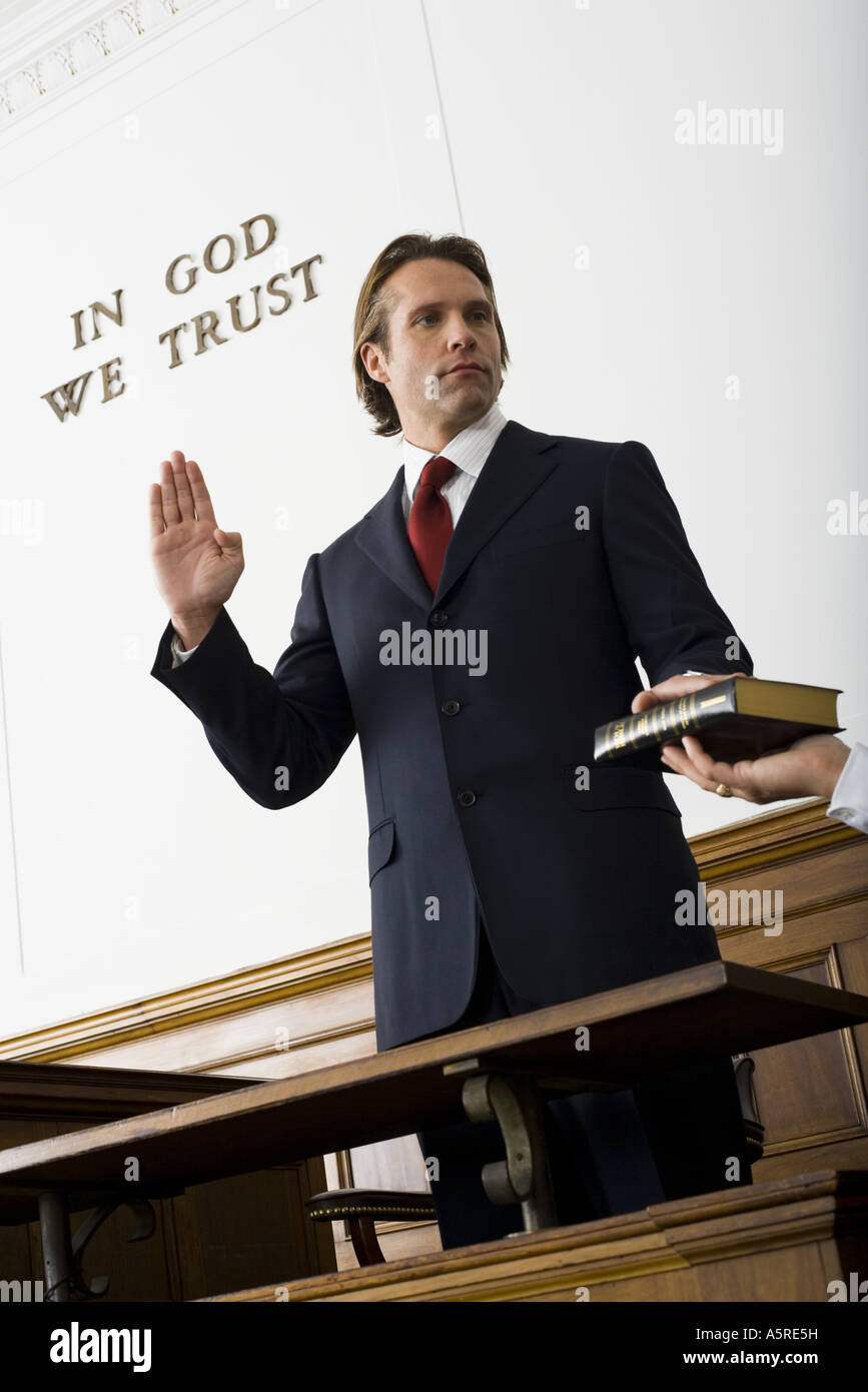 Man swearing an oath in court hi-res stock photography and images - Alamy