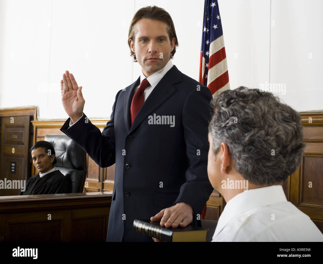 Witness swearing oath hi-res stock photography and images - Alamy