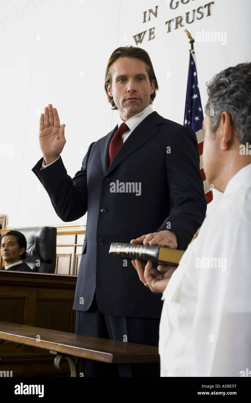 Witness swearing over the Bible Stock Photo - Alamy