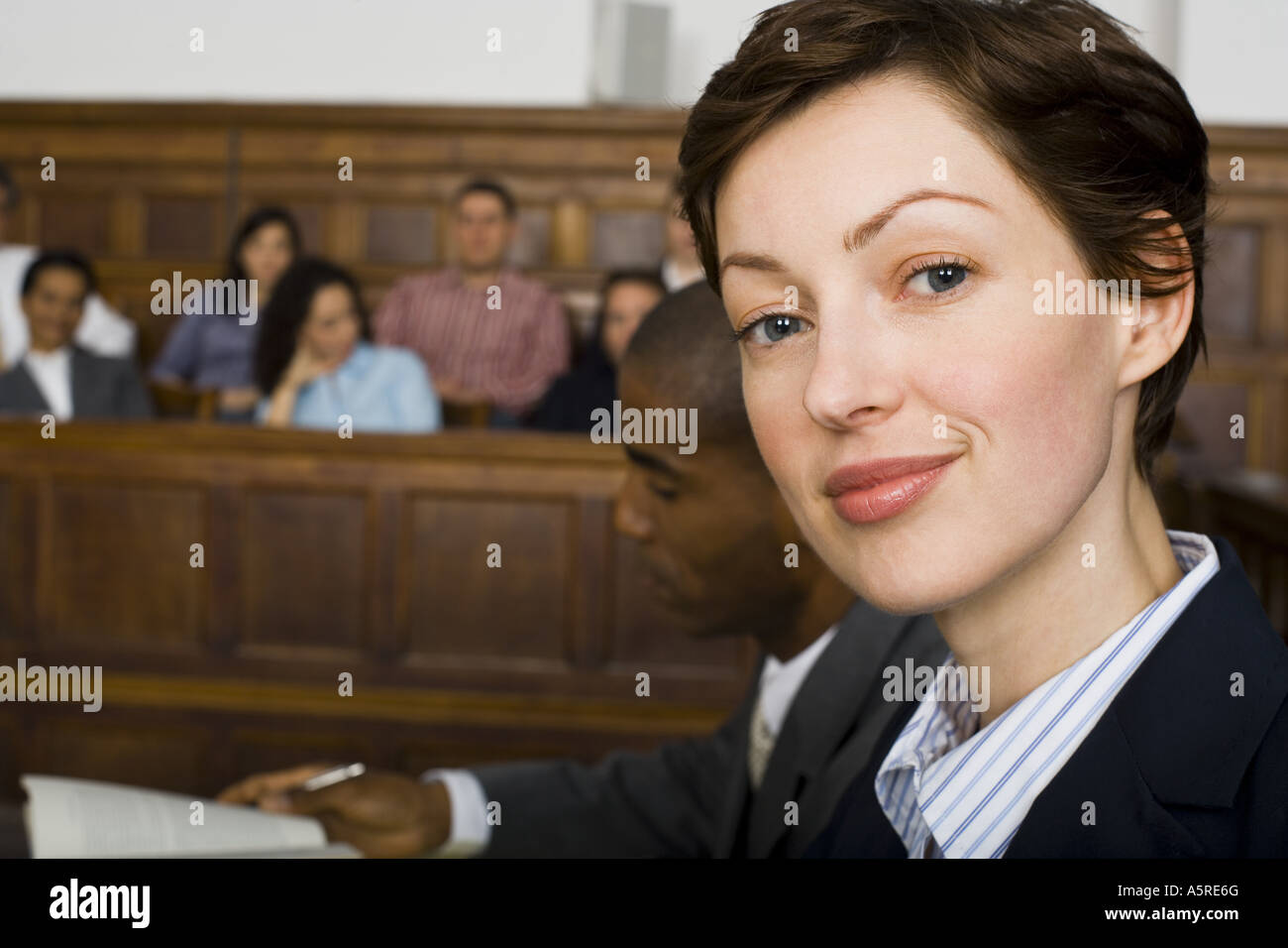 Portrait of a female lawyer smiling Stock Photo - Alamy