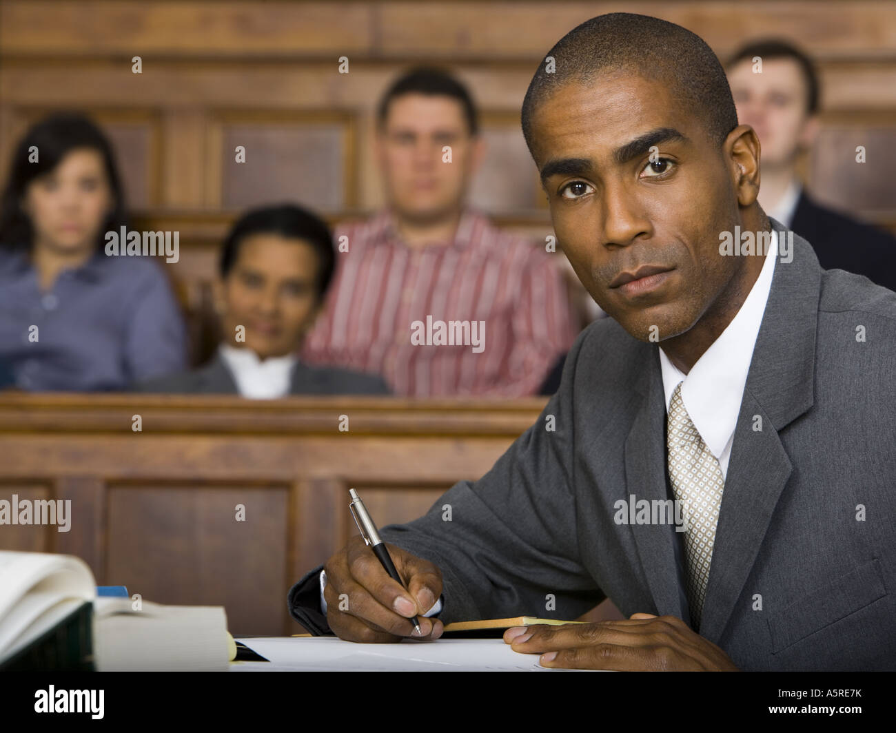 Portrait of a male lawyer sitting in a courtroom Stock Photo - Alamy