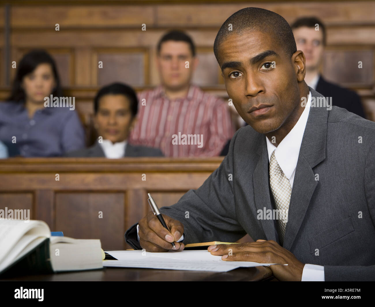 Portrait of a male lawyer sitting in a courtroom Stock Photo - Alamy