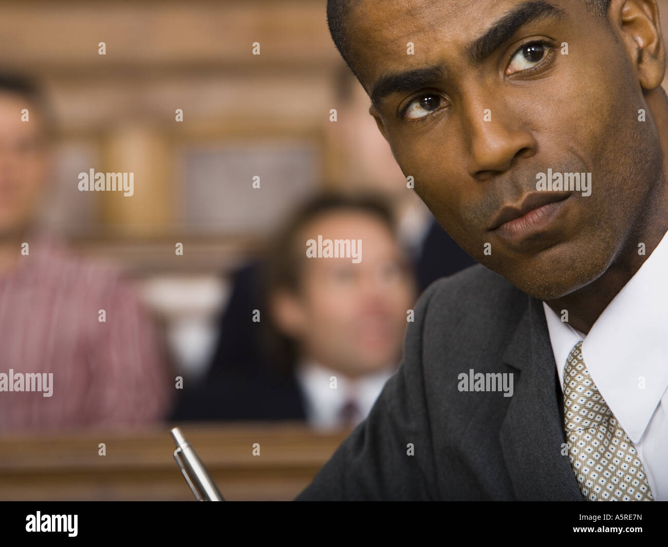Portrait of a male lawyer sitting in a courtroom Stock Photo - Alamy