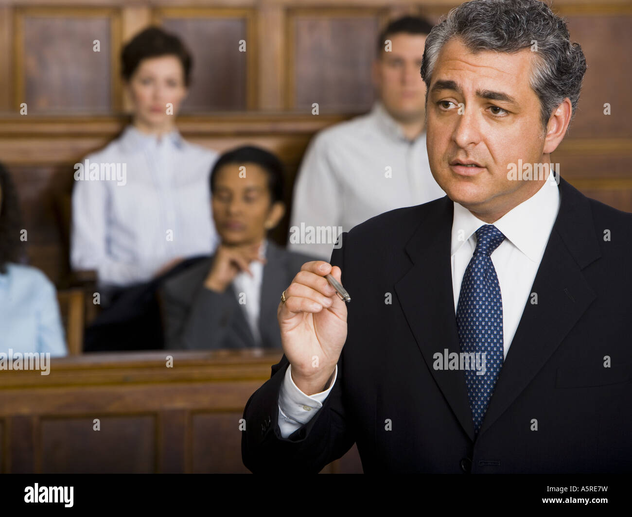 A male lawyer talking in a courtroom Stock Photo - Alamy
