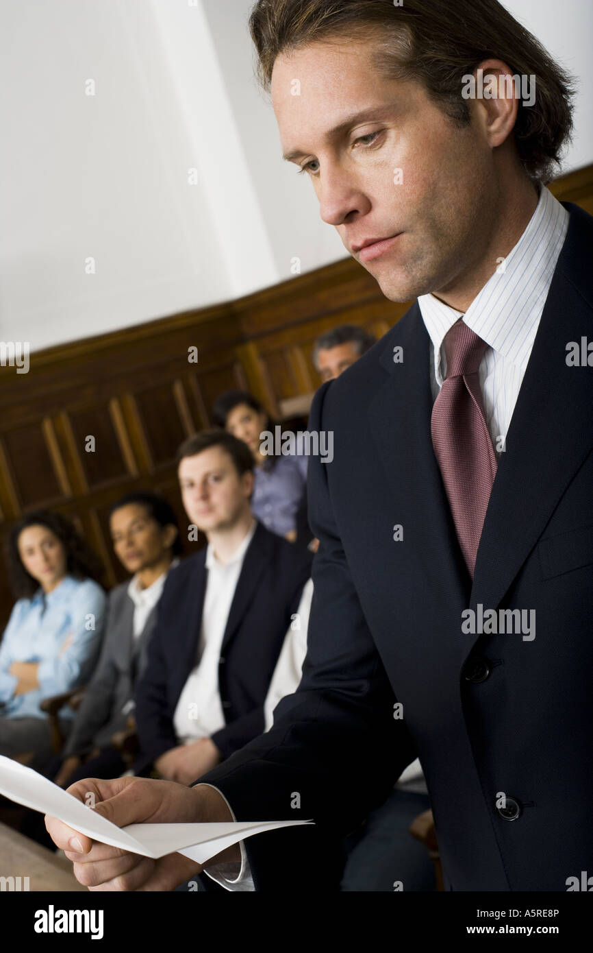 A juror standing in a jury box and reading the verdict Stock Photo - Alamy