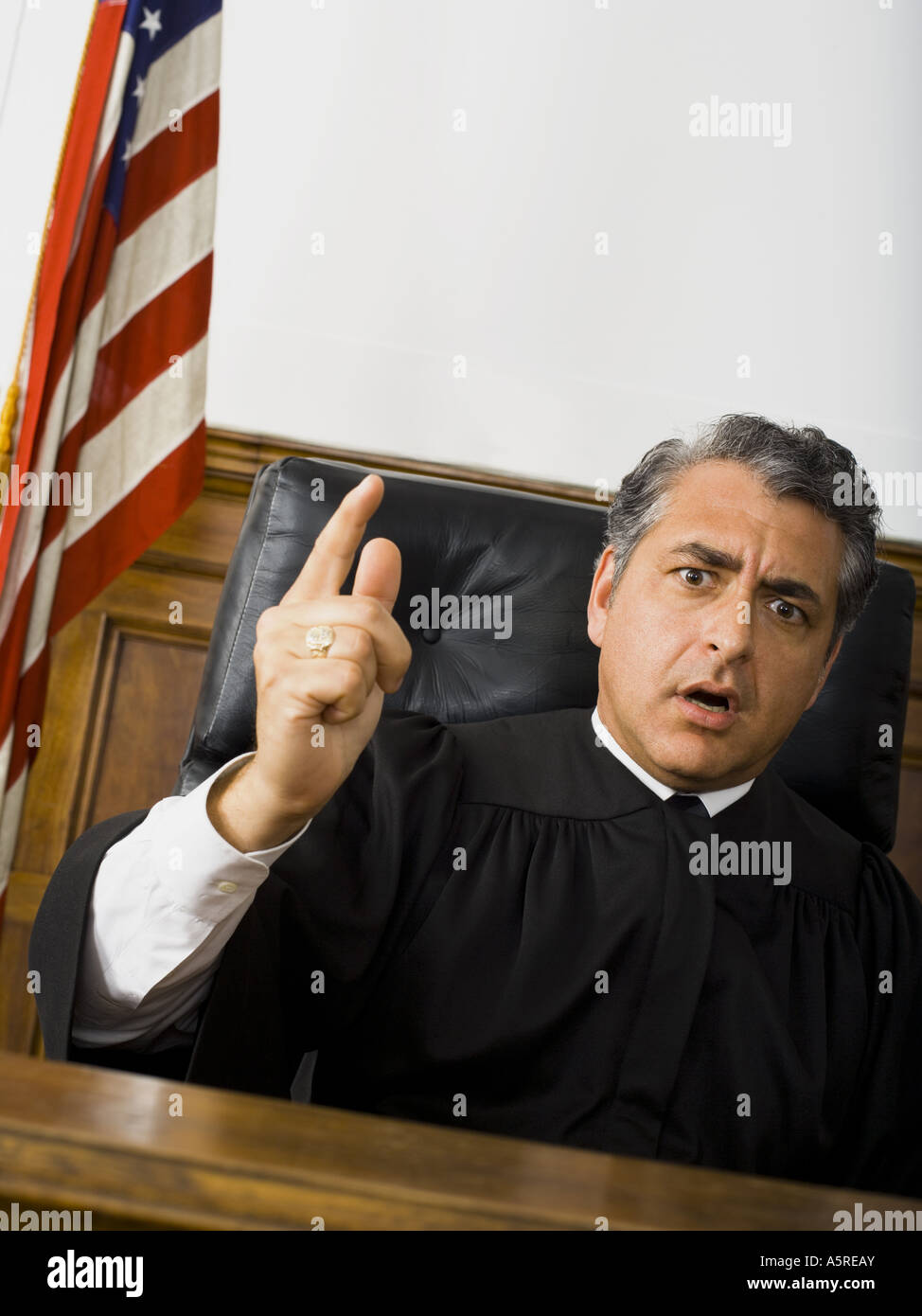 Portrait of a male judge pointing Stock Photo - Alamy