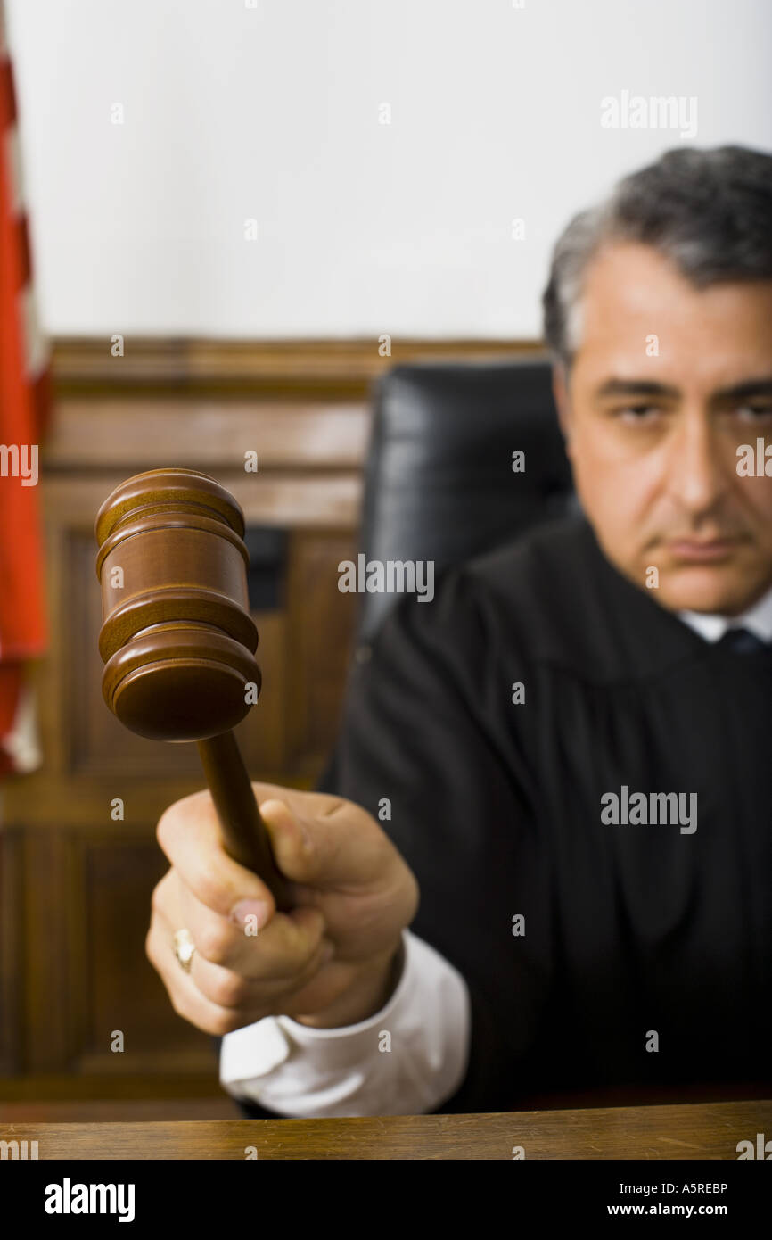 Close up of a male judge hitting a gavel on the bench Stock Photo - Alamy