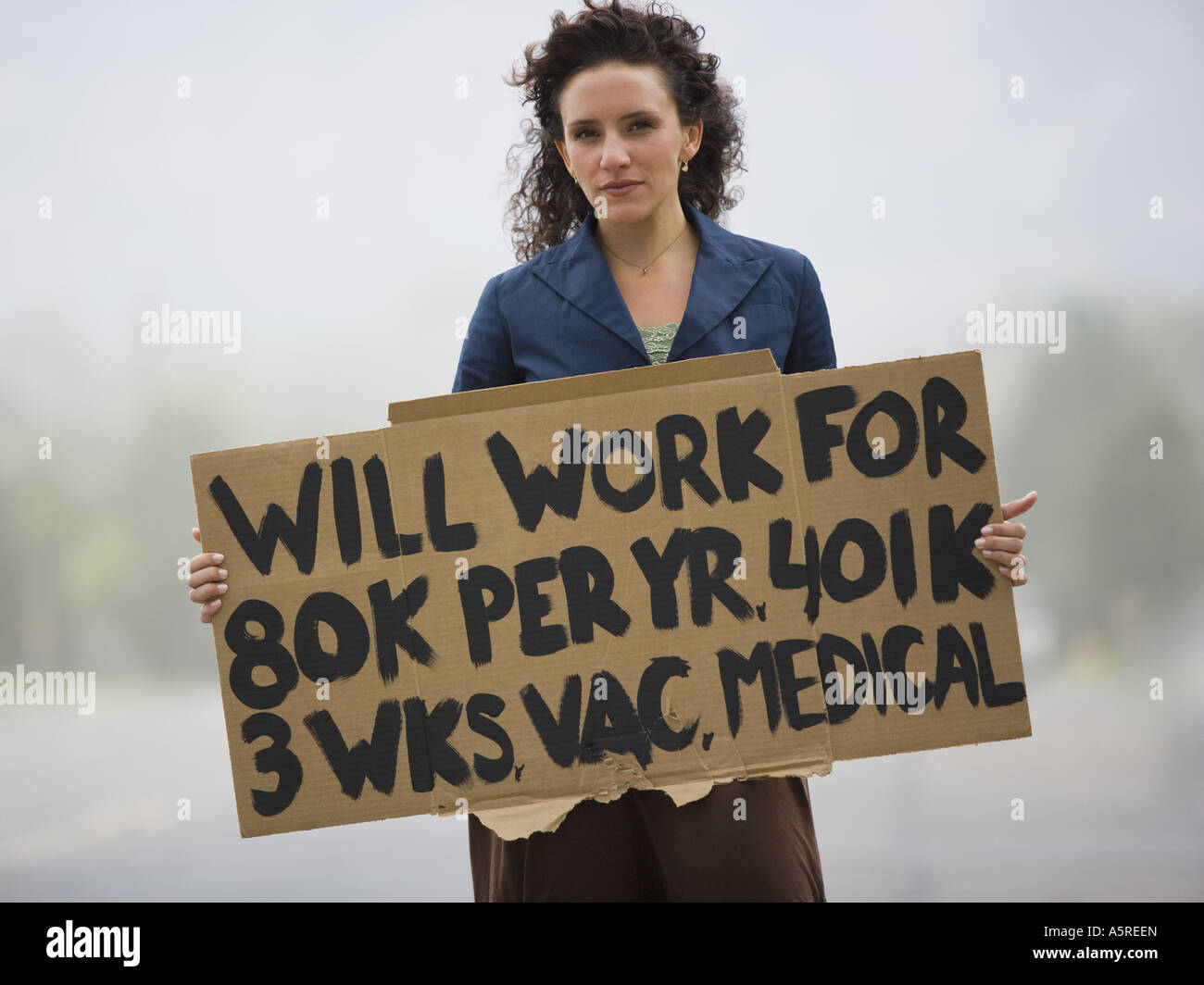 Brunette holding up help sign hi-res stock photography and images - Alamy