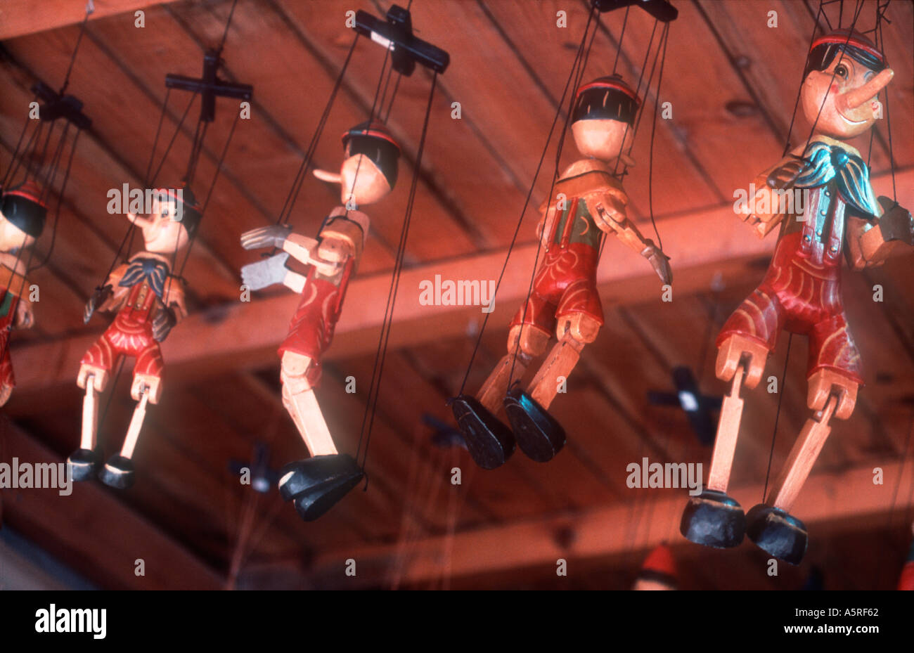 Puppets hanging from ceiling in craft shop Spain Stock Photo - Alamy