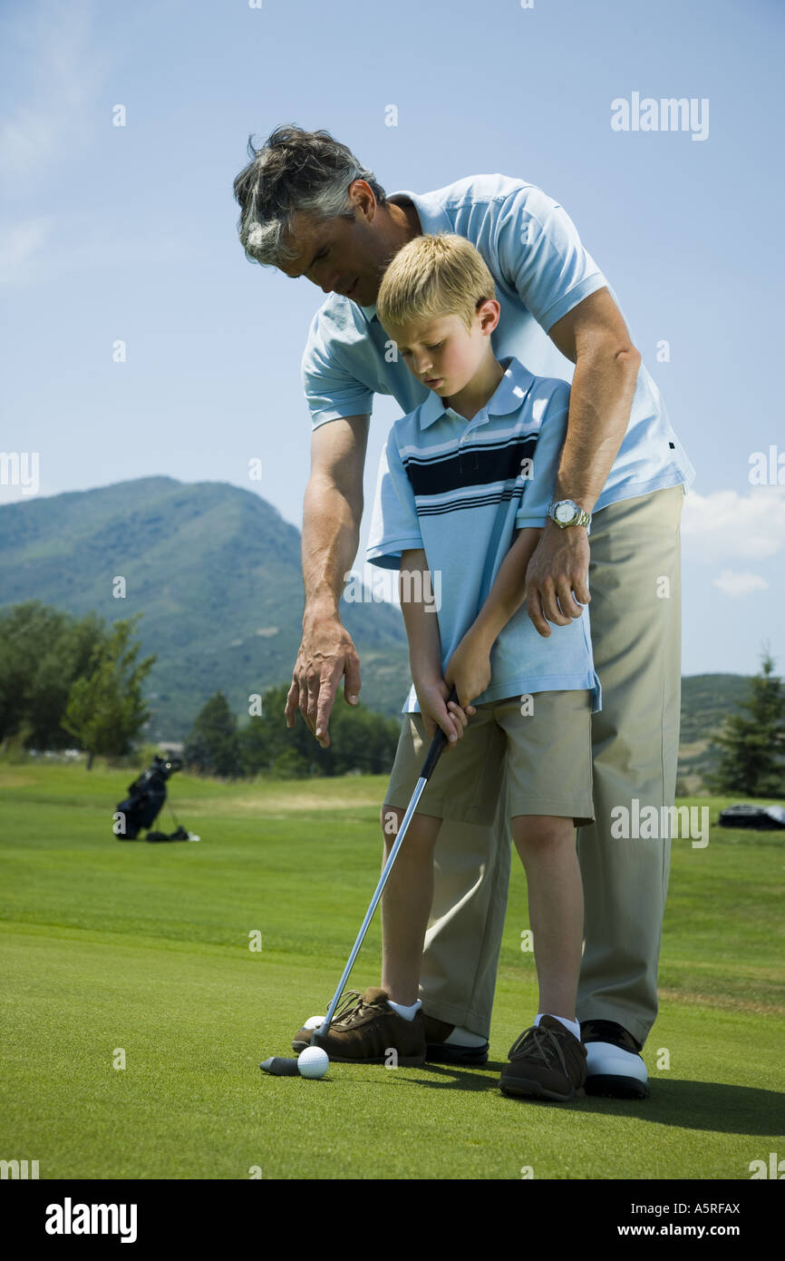 Father teaching son golf hi-res stock photography and images - Alamy