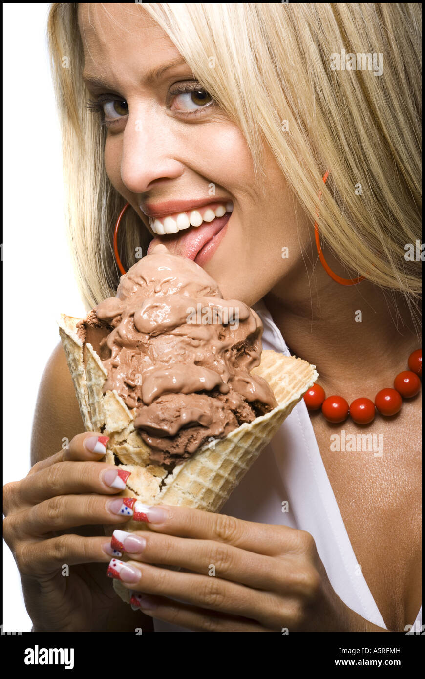 Blond woman licking ice cream hi-res stock photography and images - Alamy