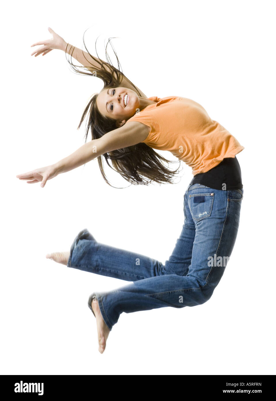 Portrait of a teenage girl jumping Stock Photo - Alamy