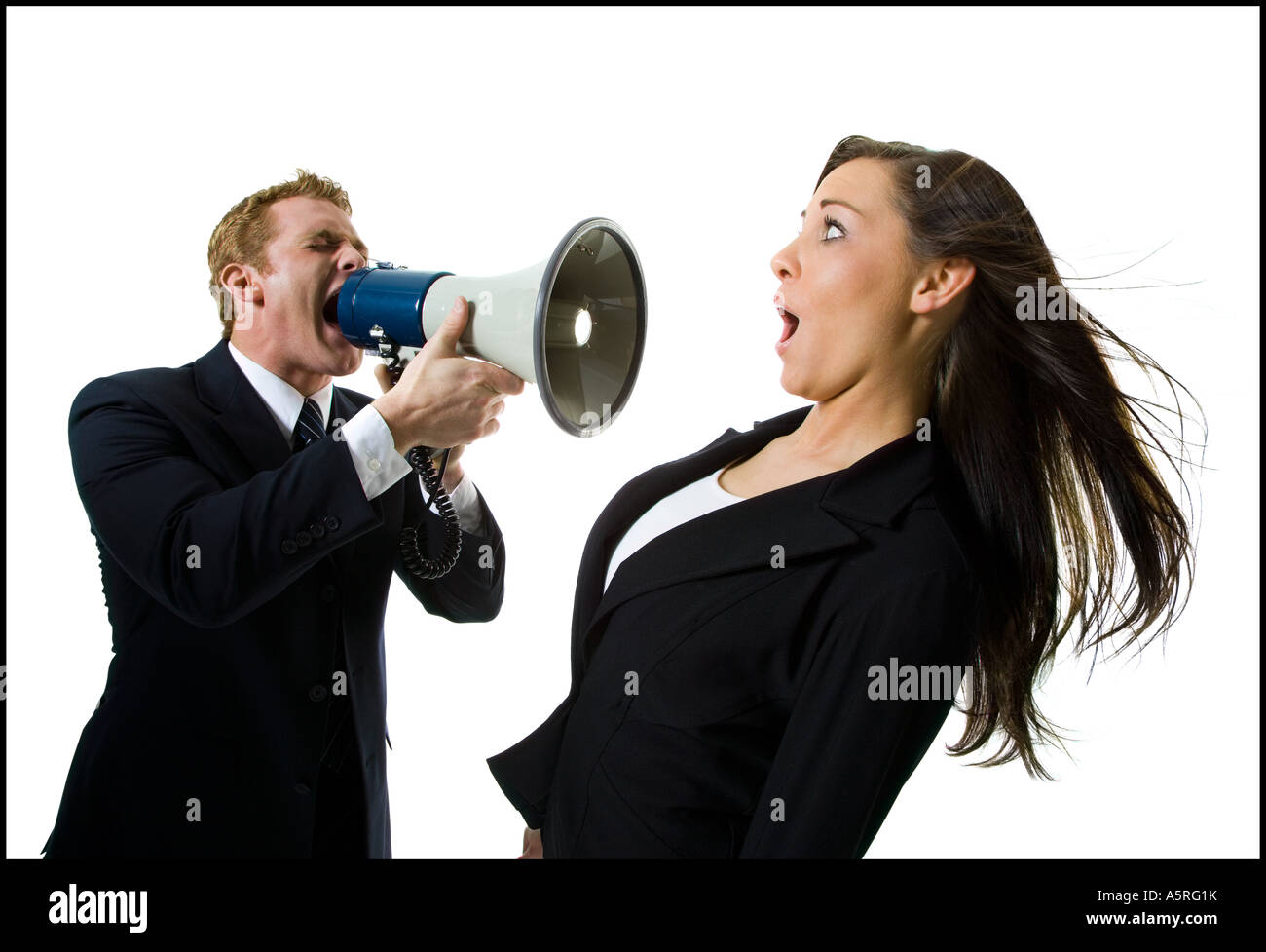 Close up of a businessman shouting at a teenage girl through a ...