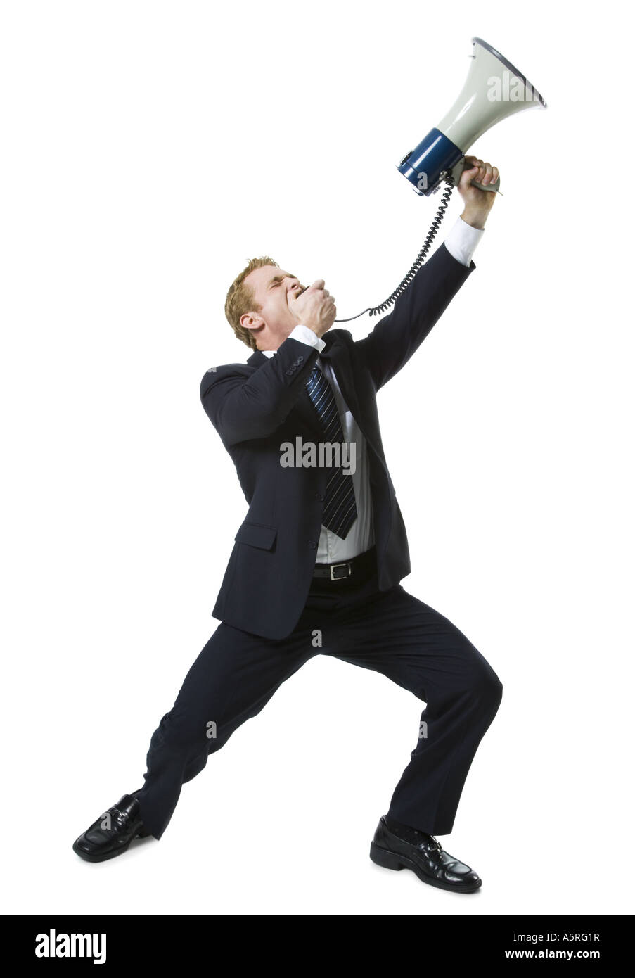Businessman shouting into a megaphone Stock Photo - Alamy