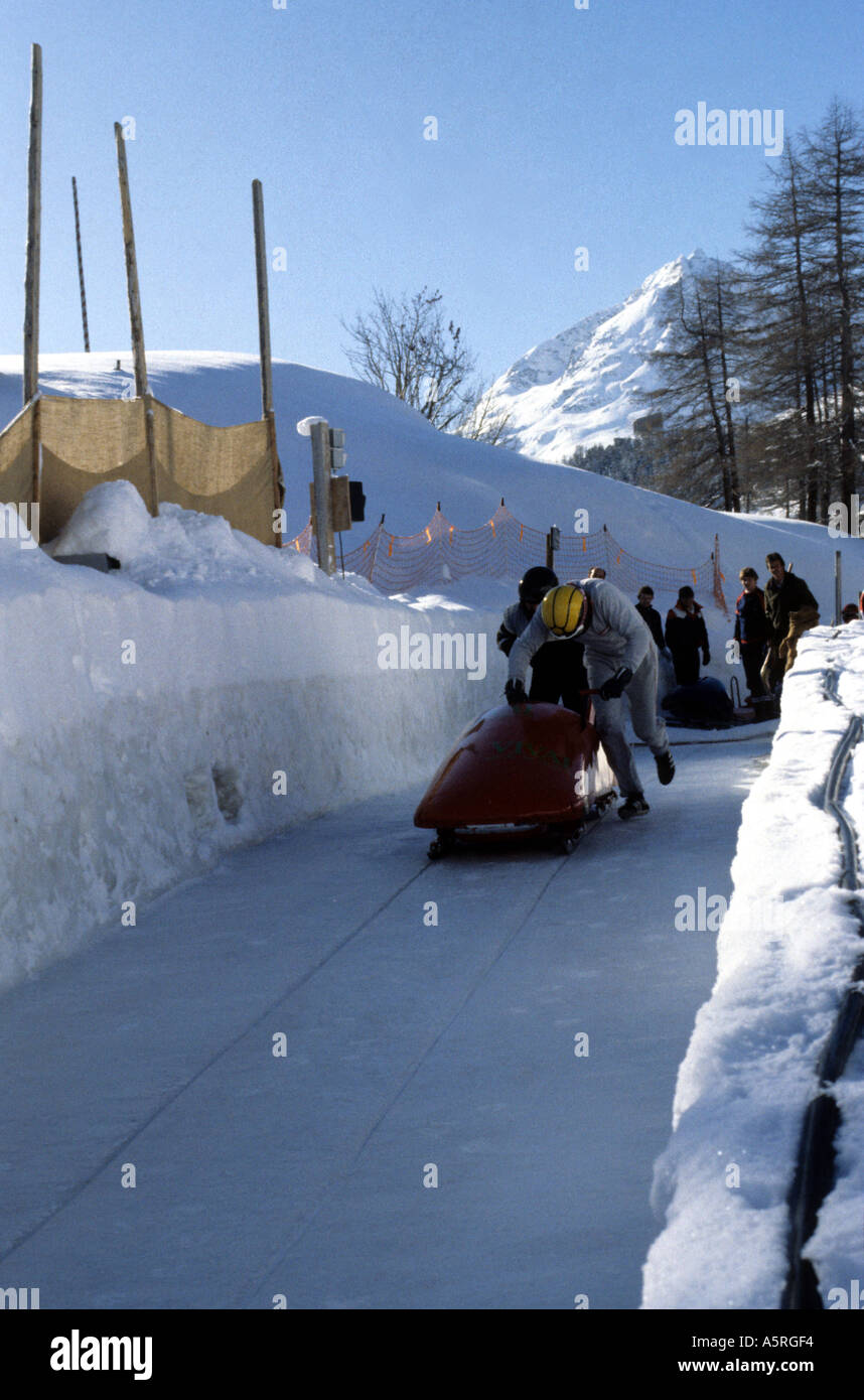 Two man bobsleigh running start on the Olympic bob run at St Moritz ...