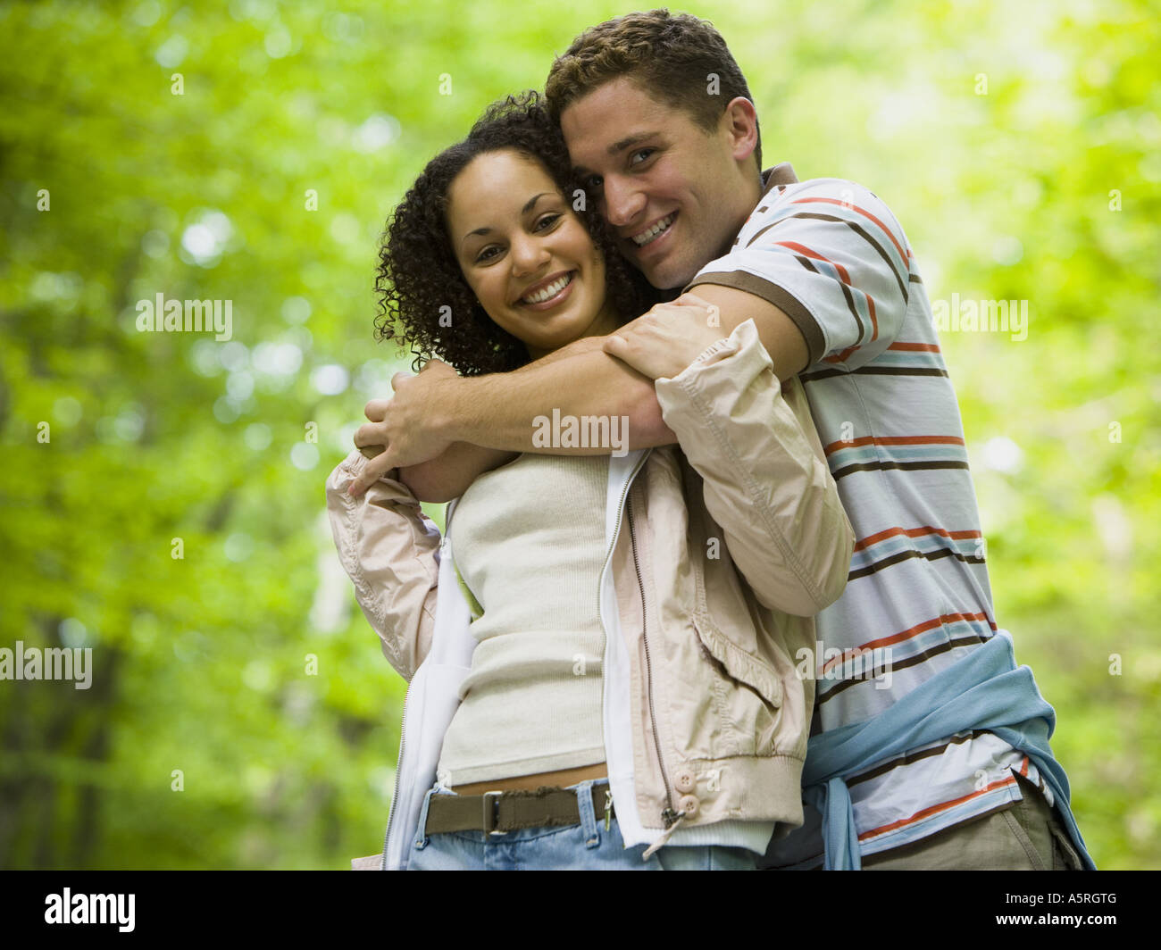 Close up of a young couple embracing each other Stock Photo - Alamy