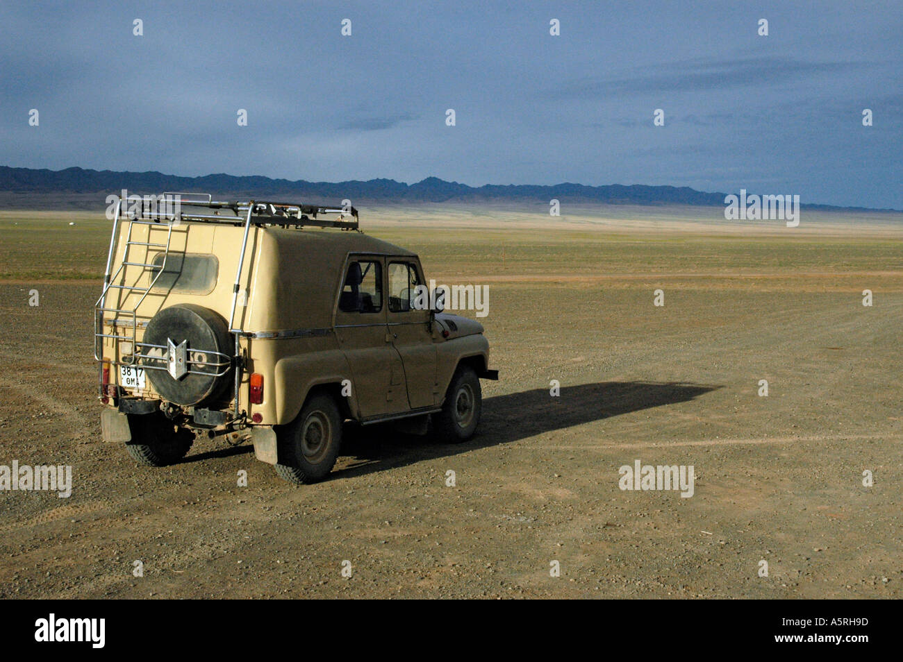 Russian Jeep UAZ in wide open steppe landscape Camp Tuvshin Mongolia ...