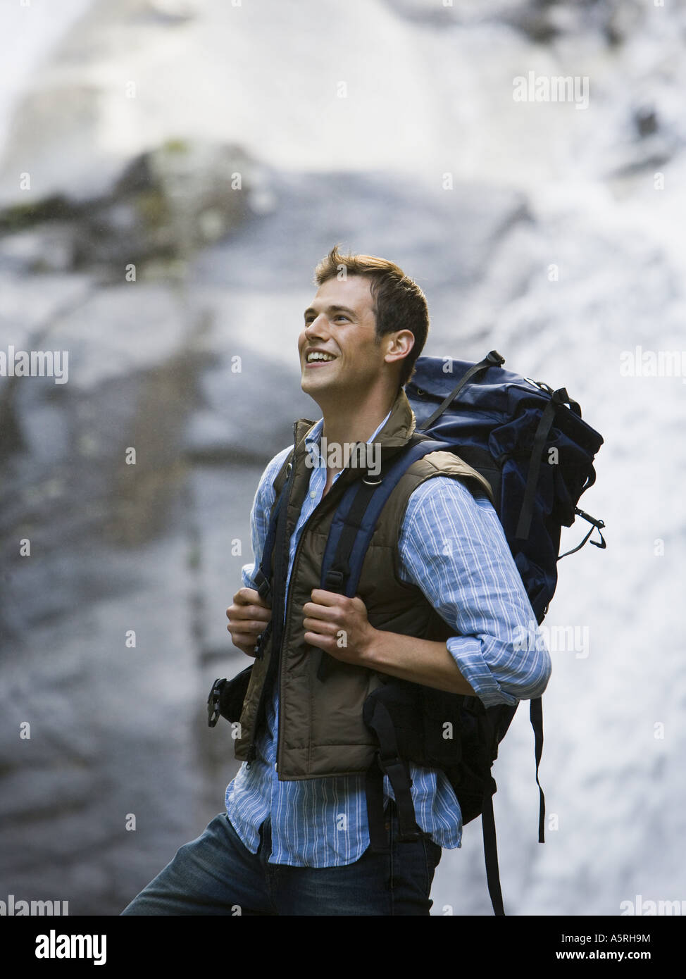 Profile of a young man carrying a backpack Stock Photo - Alamy